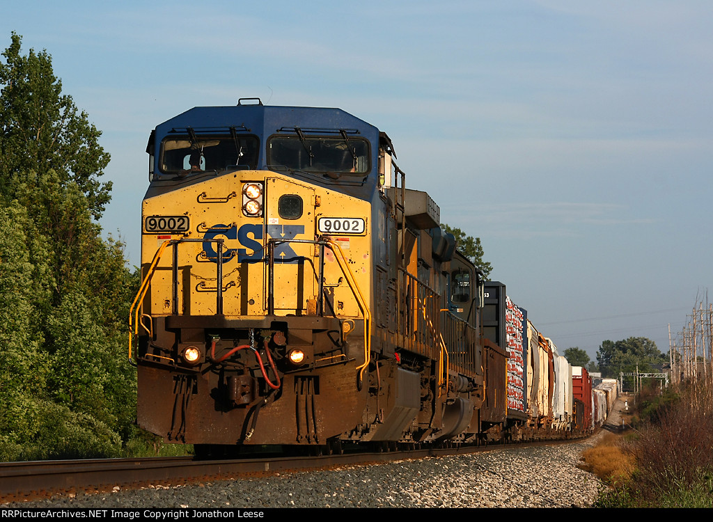 CSX 9002 leads Q335-21 through the sag between 36th and 32nd streets
